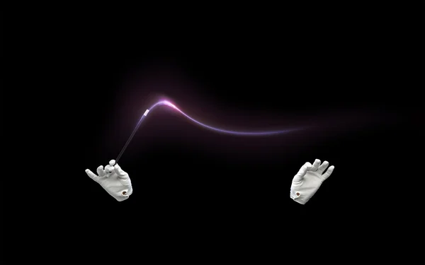 Magician hands with magic wand showing trick Stock Photo by ©Syda ...