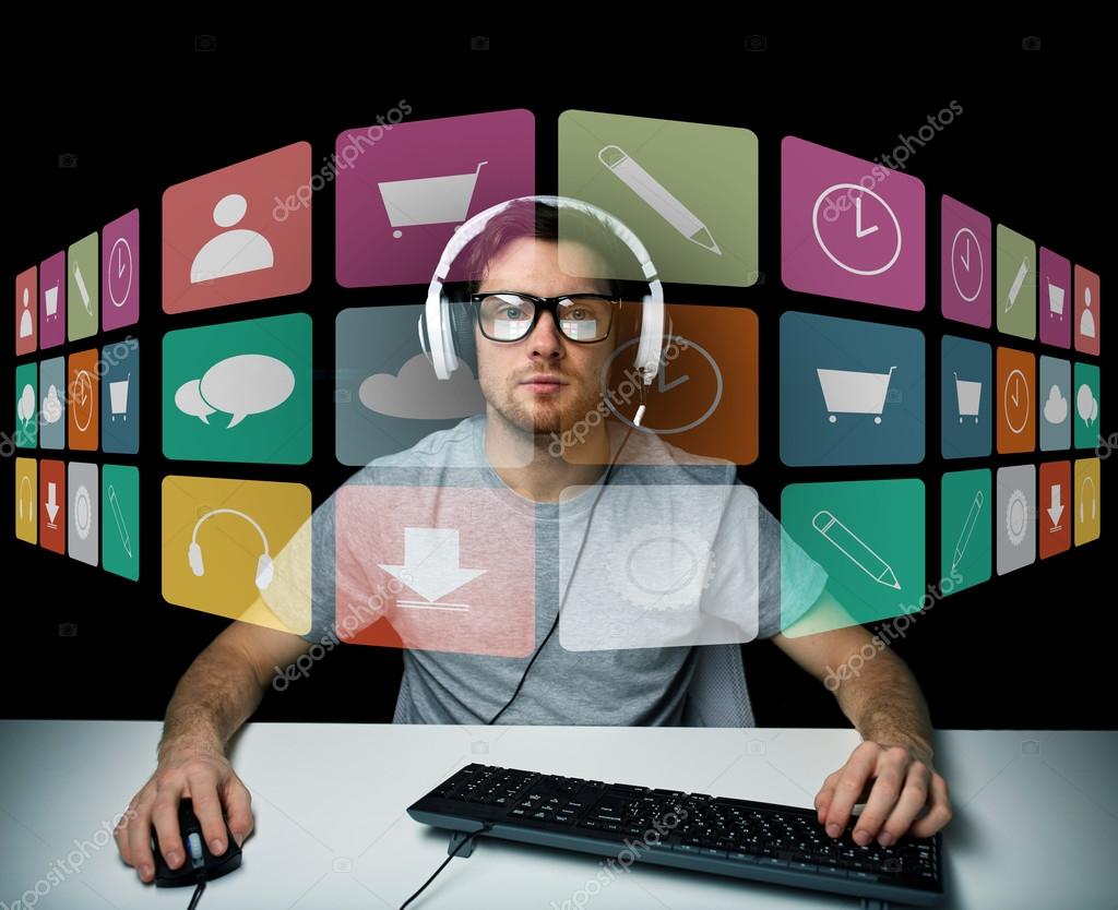 Man in headset with computer and icons on screen — Stock Photo © Syda ...