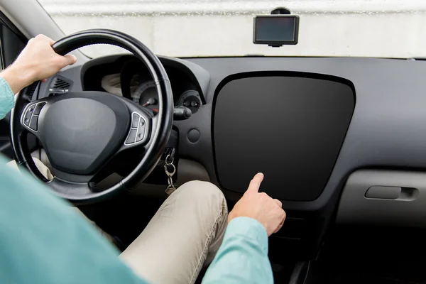 man driving car and pointing to on-board computer - Stock Image ...