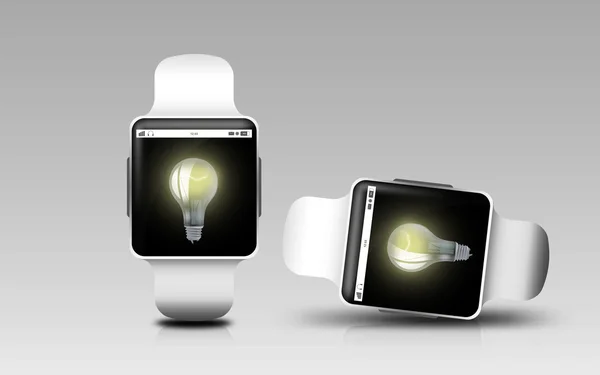 smart watches with light bulb on screen - Stock Image - Everypixel
