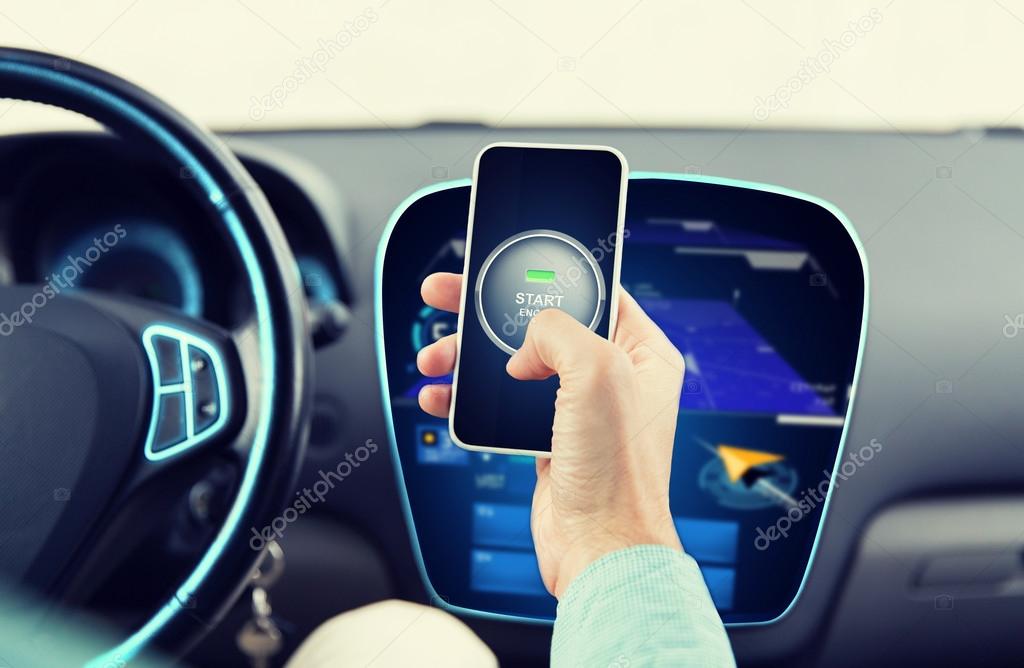 Hands with start engine icon on smartphone in car Stock Photo by ©Syda ...