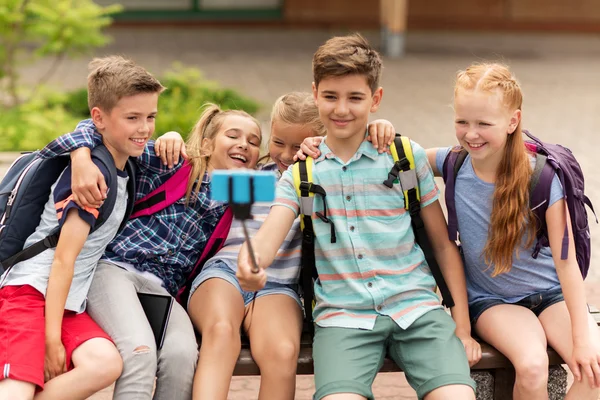 happy elementary school students taking selfie - Stock Image - Everypixel