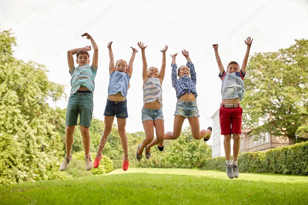 Happy kids jumping and having fun in summer park ⬇ Stock Photo, Image ...
