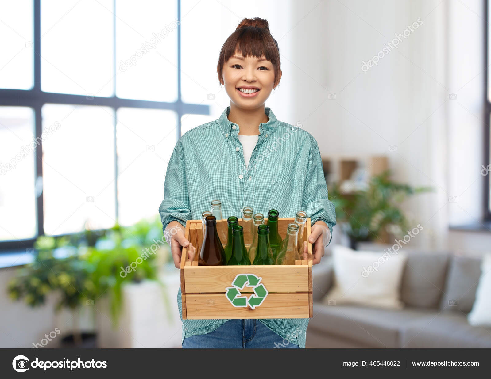 Smiling young asian woman sorting glass waste — Stock Photo © Syda ...