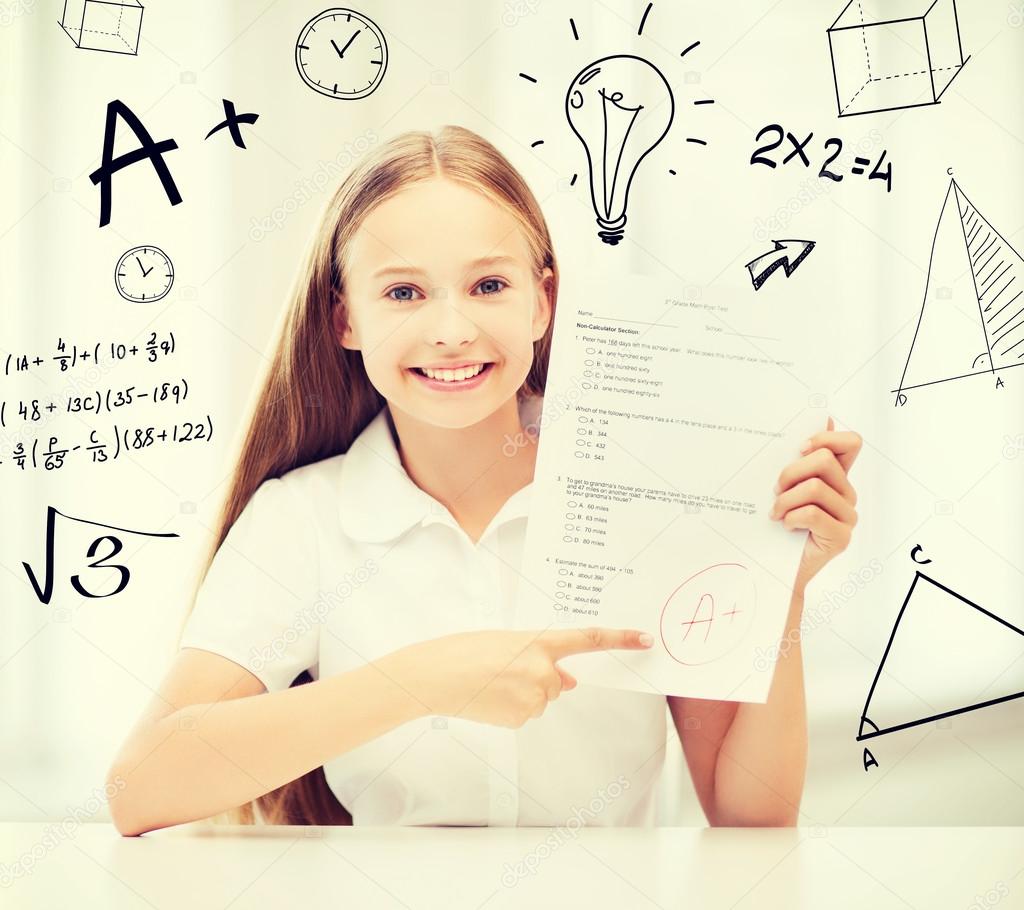 Girl with test and A grade at school Stock Photo by ©Syda_Productions ...