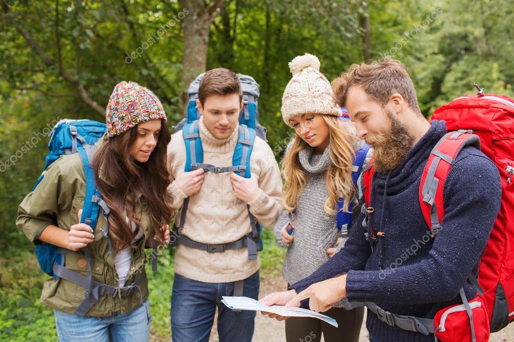 Group of smiling friends with backpacks hiking Stock Photo by ©Syda ...