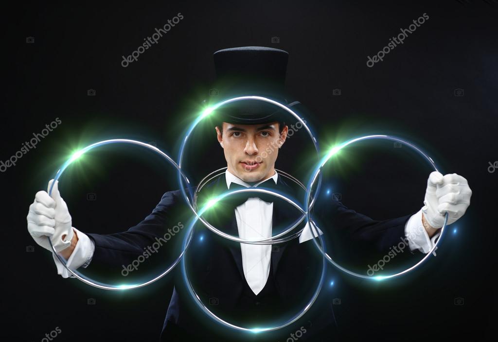 Magician showing trick with linking rings Stock Photo by ©Syda ...