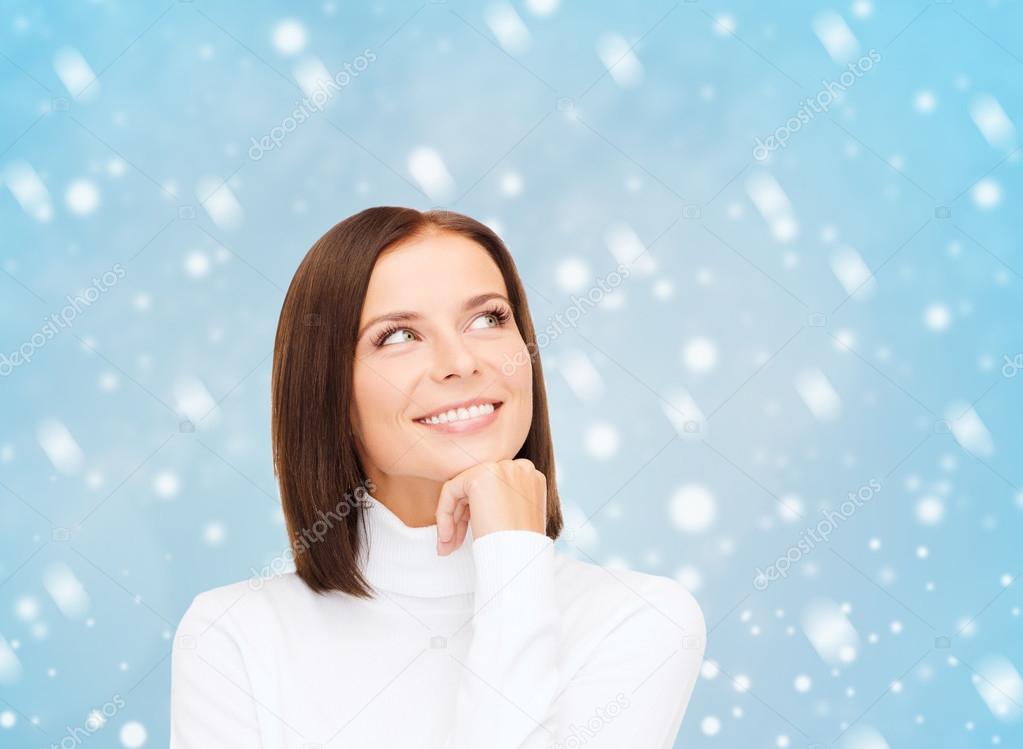 Thinking and smiling woman in white sweater — Stock Photo © Syda ...