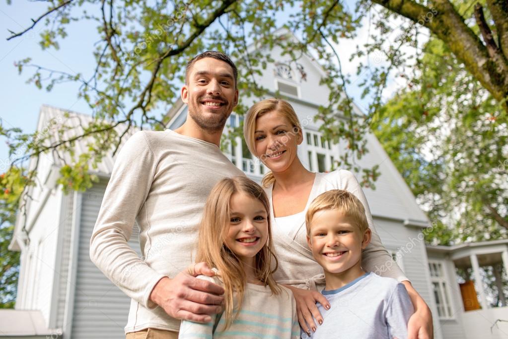 Happy family in front of house outdoors — Stock Photo © Syda ...