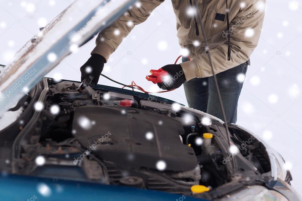Closeup of man under bonnet with starter cables — Stock Photo © Syda ...