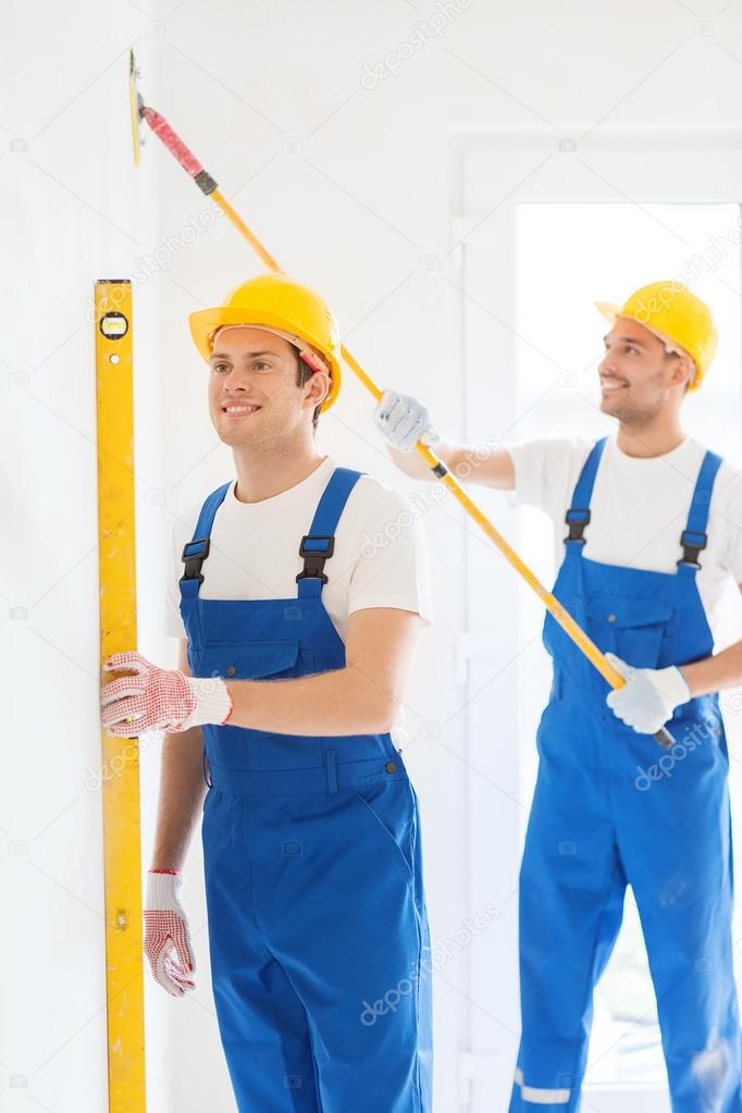 Group of builders with tools indoors Stock Photo by ©Syda_Productions ...