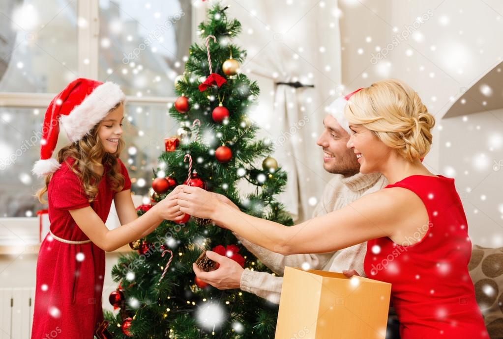 People Decorating Christmas Tree