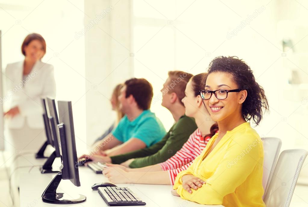 Female student with classmates in computer class — Stock Photo © Syda ...