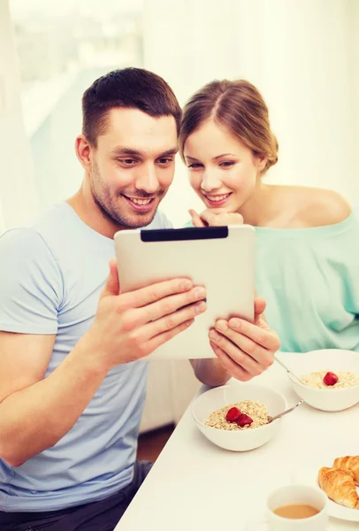 Smiling couple with taking picture with tablet pc - Stock Image ...