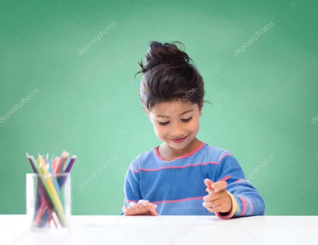 Happy school girl drawing with coloring pencils — Stock Photo © Syda ...