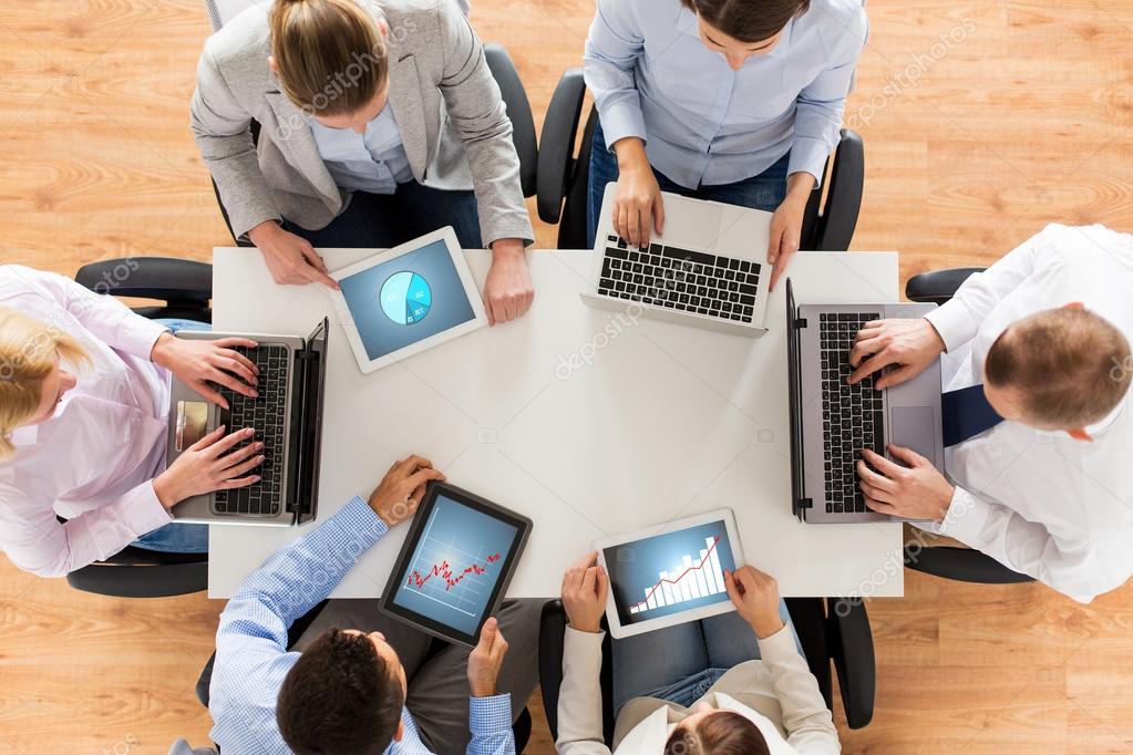 Business team with laptop and tablet pc Stock Photo by ©Syda ...