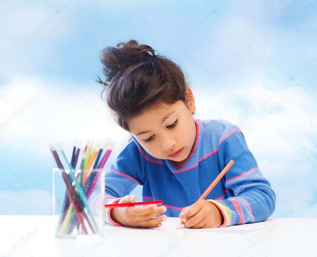 Little girl drawing Stock Photo by ©Syda_Productions 69740421