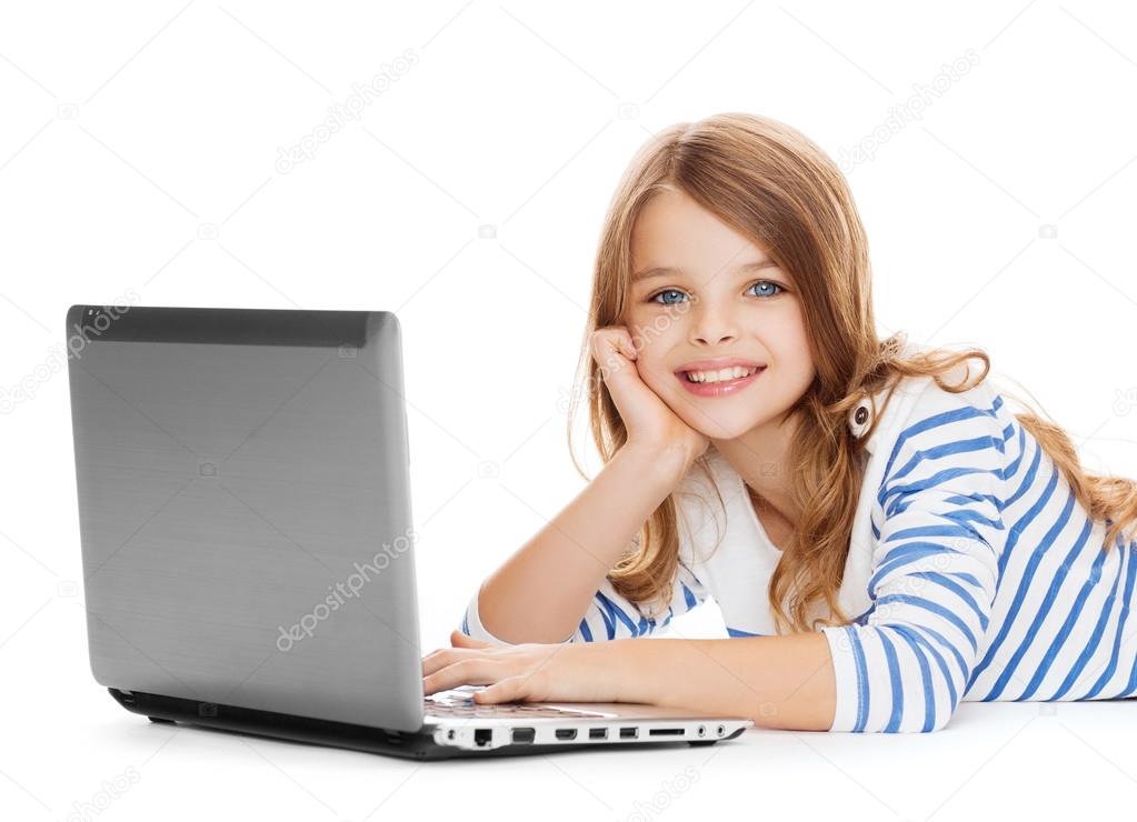 Smiling student girl with laptop computer lying Stock Photo by ©Syda ...