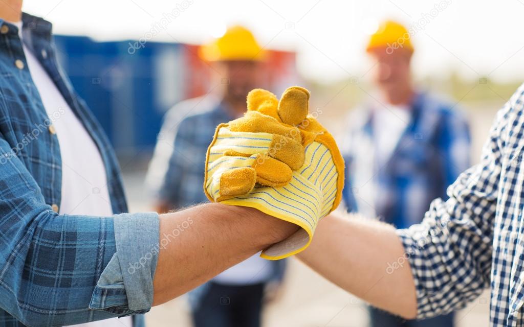 Close up of builders hands making handshake Stock Photo by ©Syda ...