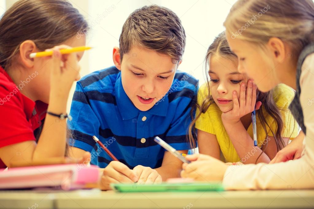 Group of students talking and writing at school Stock Photo by ©Syda ...
