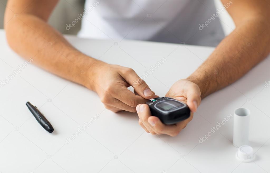 Close up of man checking blood sugar by glucometer — Stock Photo © Syda ...