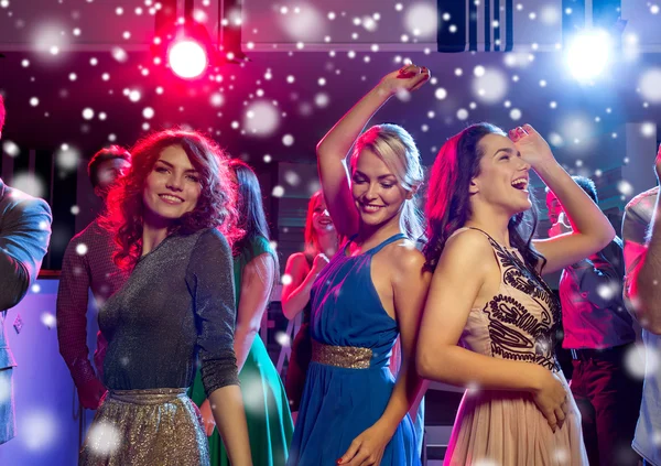 smiling friends dancing in club - Stock Image - Everypixel