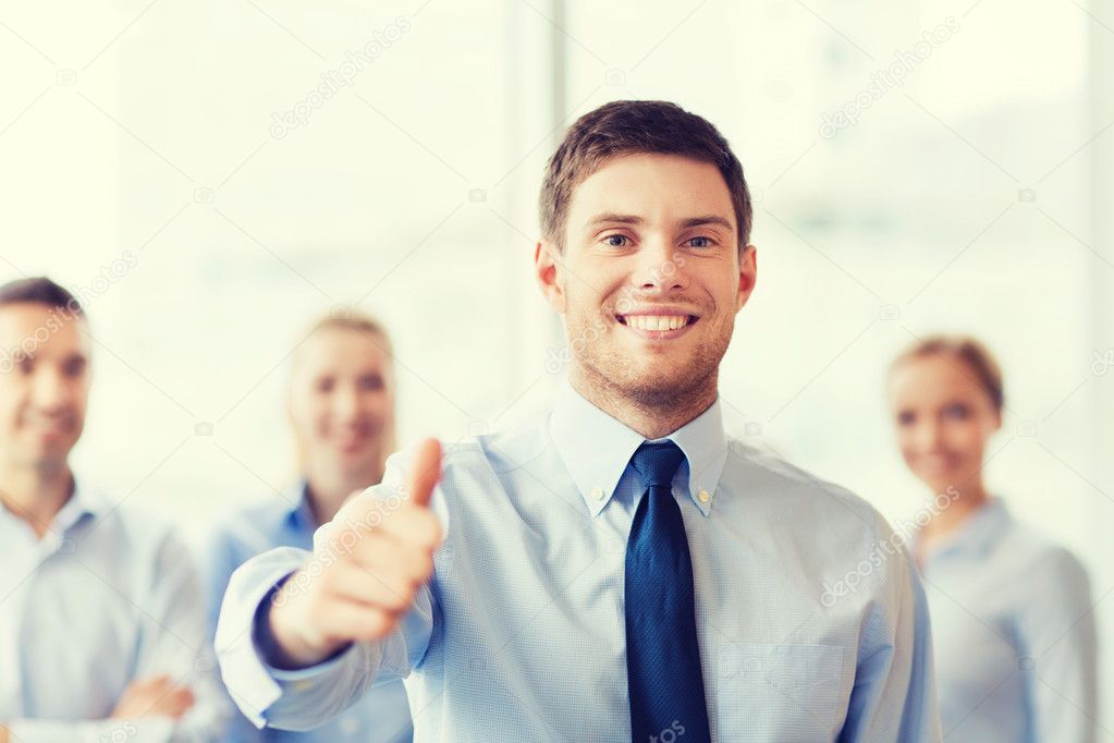 Smiling businessman showing thumbs up in office — Stock Photo © Syda ... Smiling businessman showing thumbs up in office — Stock Photo © Syda ...