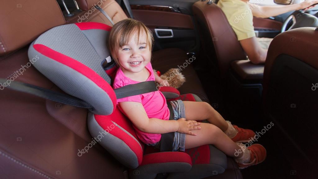 Happy child sitting in car seat and father driving — Stock Photo © Syda ...