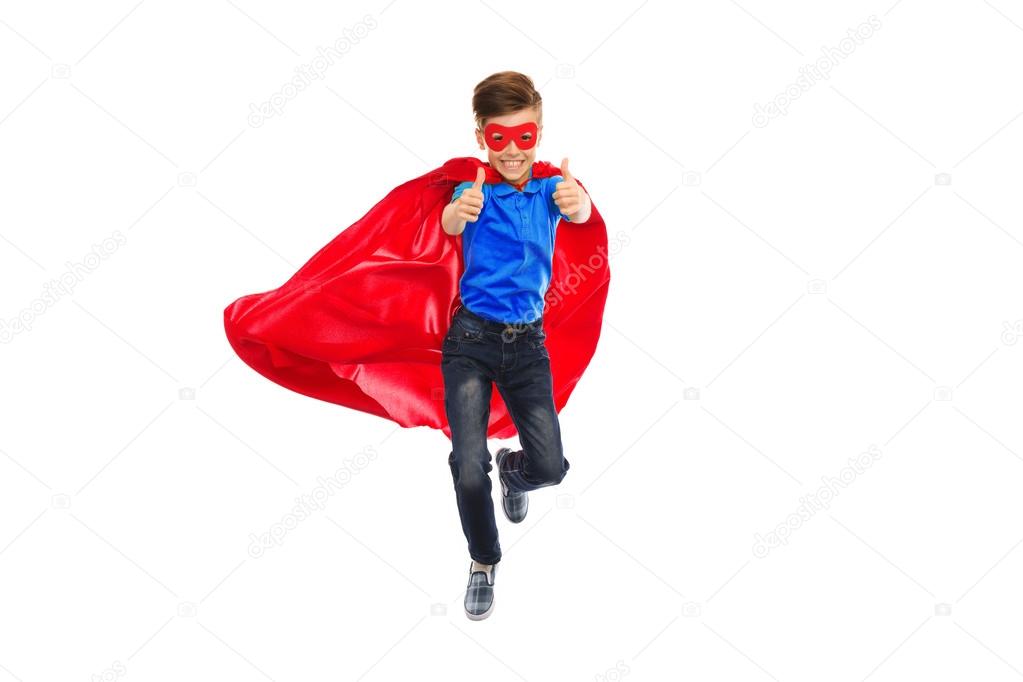 Boy in super hero cape and mask showing thumbs up — Stock Photo © Syda ...