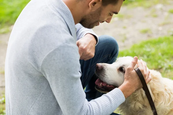 Close up of man with labrador dog outdoors - Stock Image - Everypixel
