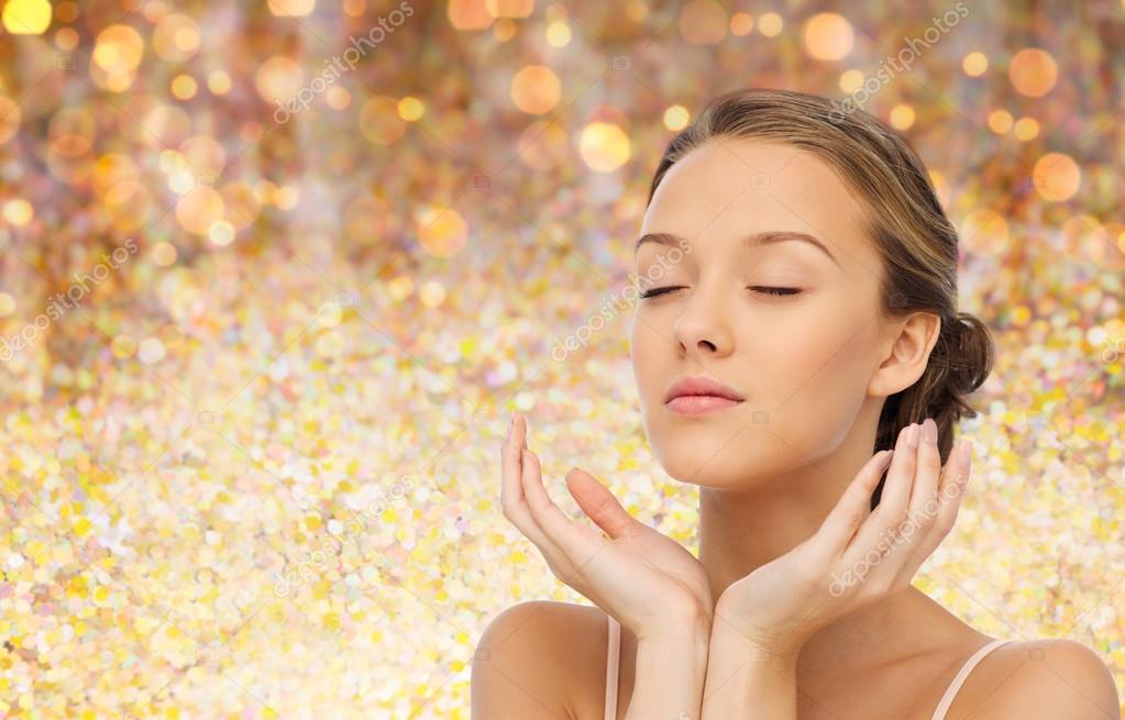 Young woman face and hands Stock Photo by ©Syda_Productions 92773494