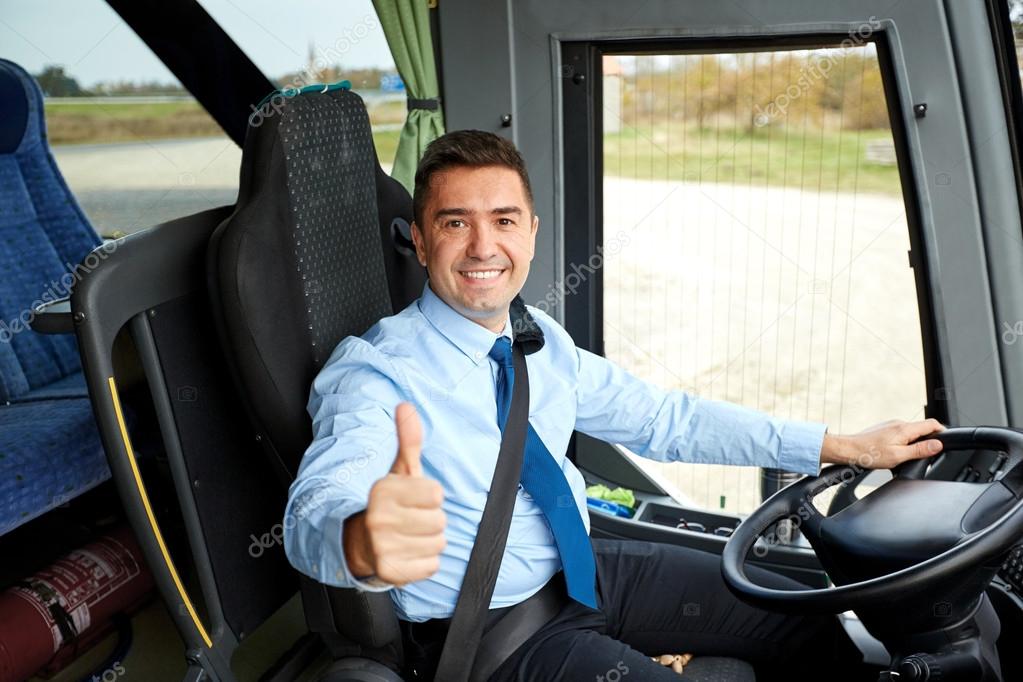 Happy driver driving bus and snowing thumbs up — Stock Photo © Syda ...
