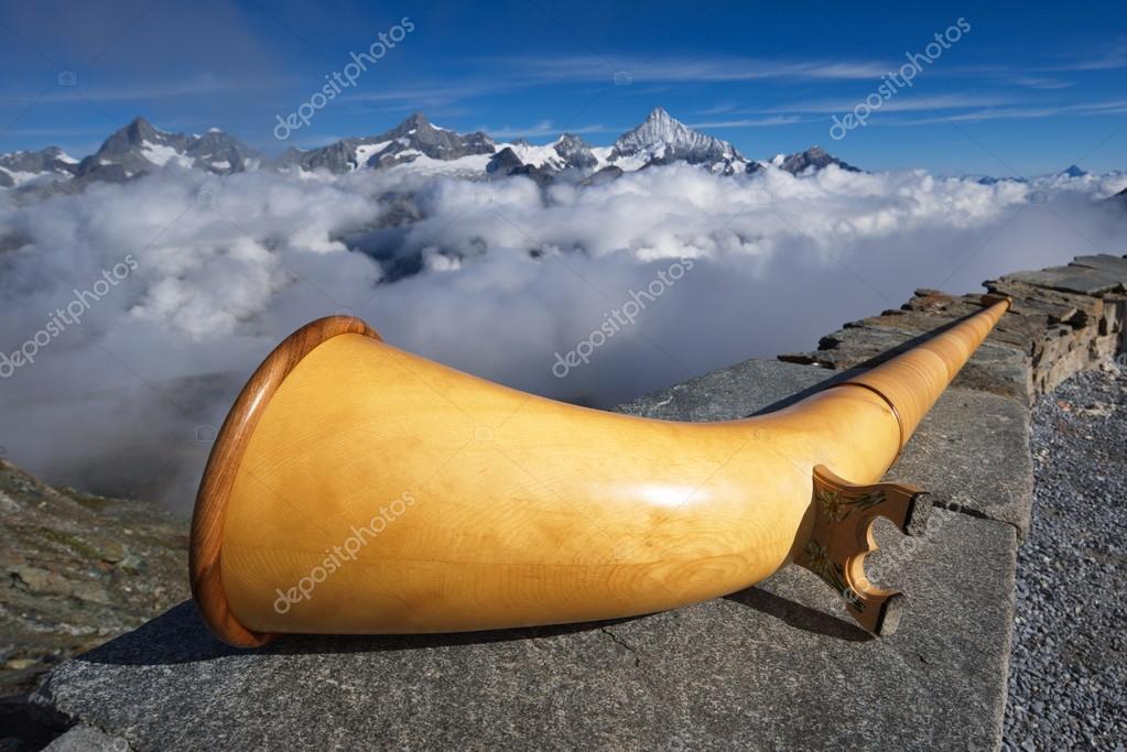 Alpine horn and mountains Stock Photo by ©tomazkunst 105097890