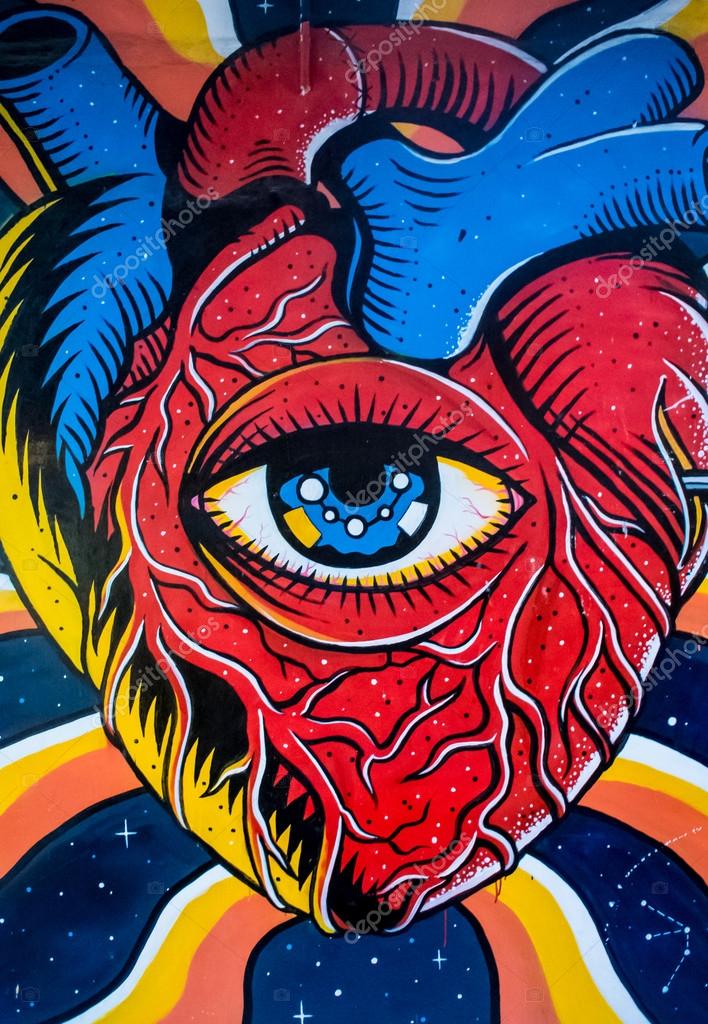 Colorful graffiti art line the street walls and back alleys of Siam ...