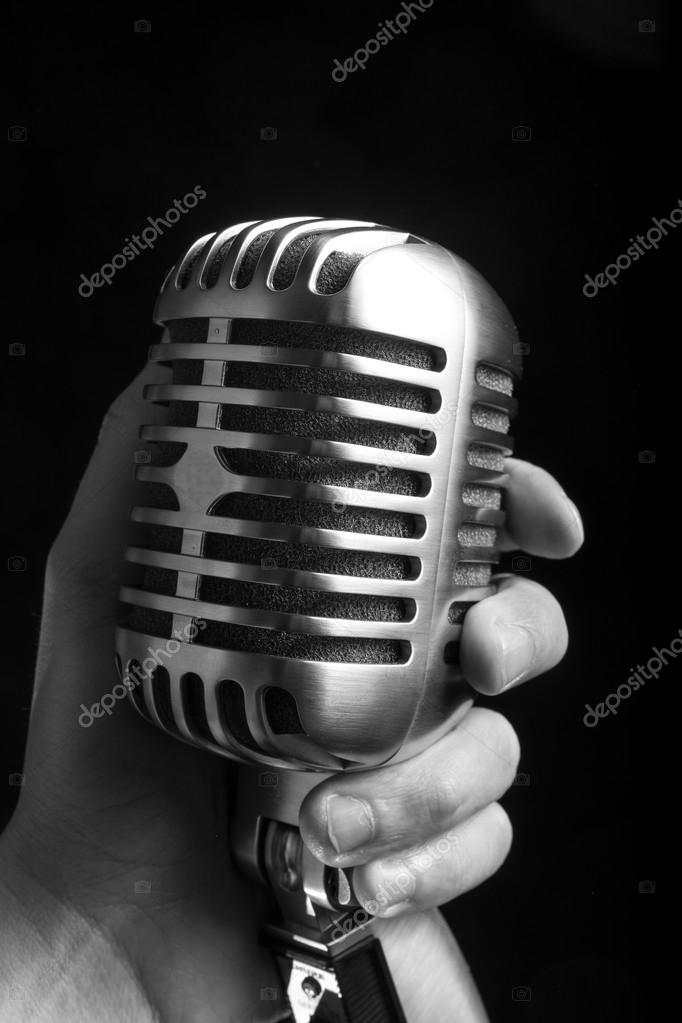 Vintage microphone on black background Stock Photo by ©anderm 104006928