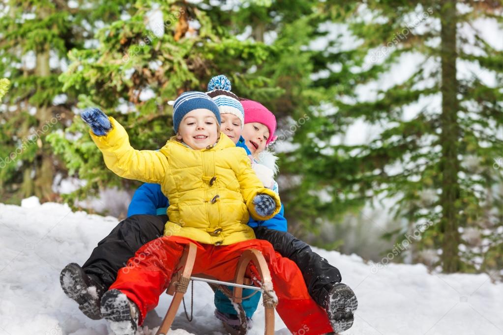 Group of kids on sledge Stock Photo by ©serrnovik 117648684