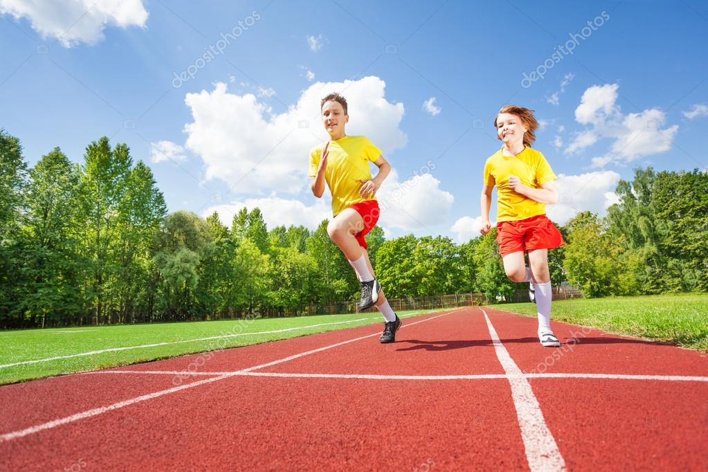 Two guys running together Stock Photo by ©serrnovik 52716823