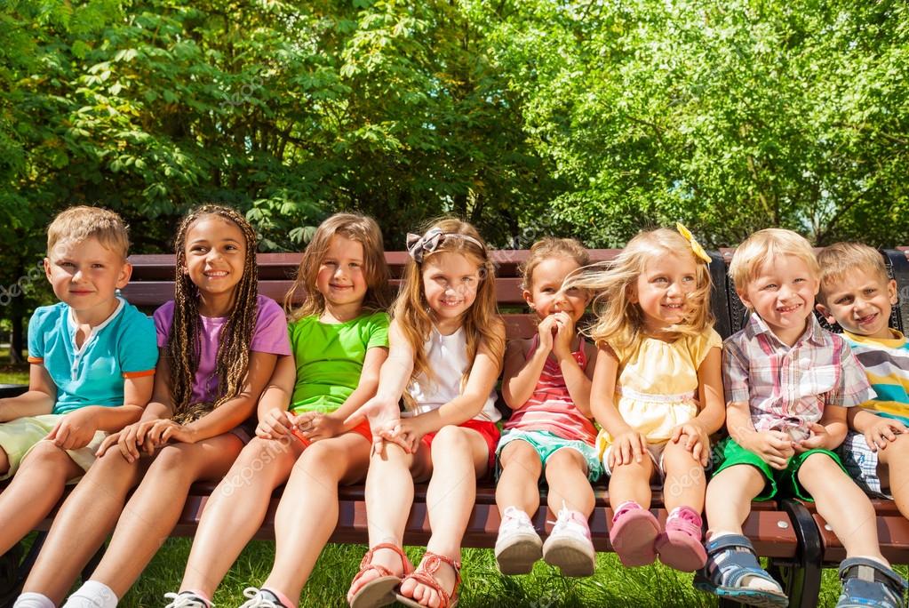 Kids in row on bench Stock Photo by ©serrnovik 52724623