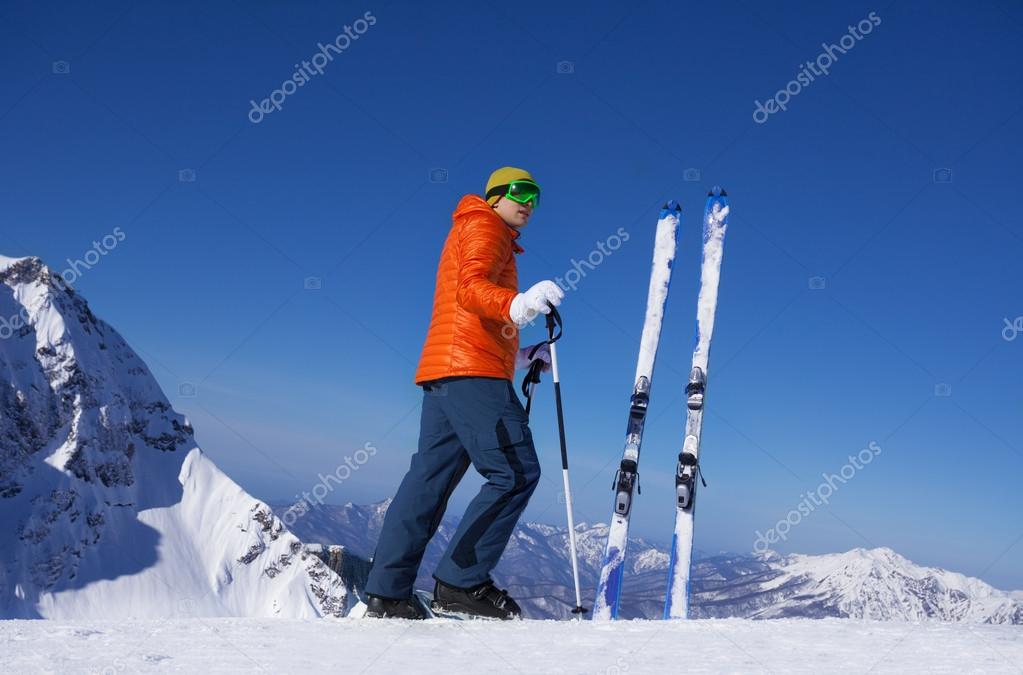Man standing with ski in snow — Stock Photo © serrnovik #66044449