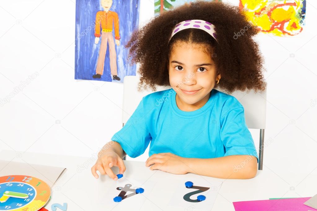 Cute African girl learn numbers — Stock Photo © serrnovik #77372166
