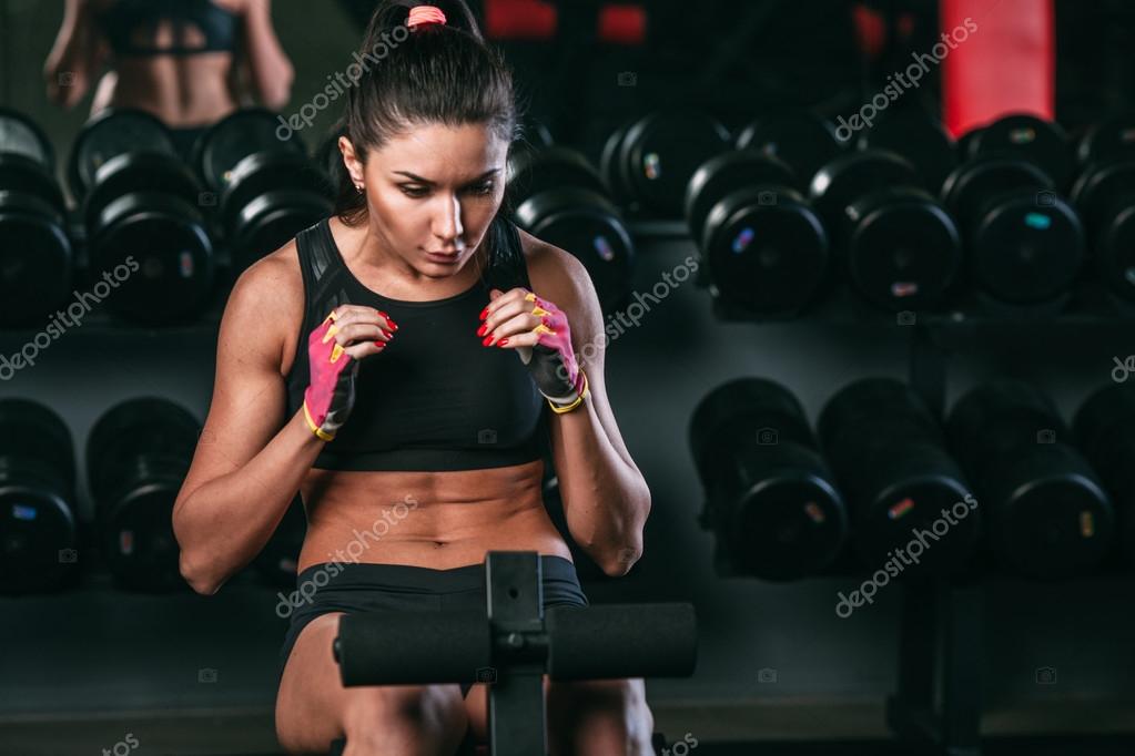 Fitness woman doing abdominal crunch in gym woking out Stock Photo by ...