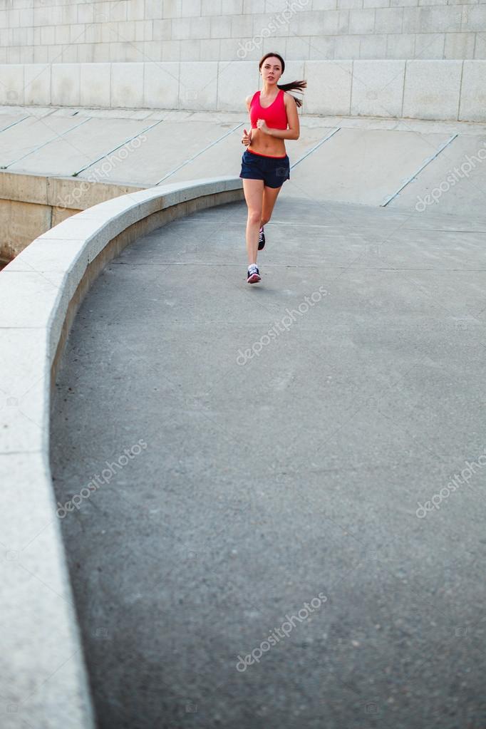 Woman runnning along granite curved parapet Stock Photo by ©chesterf ...