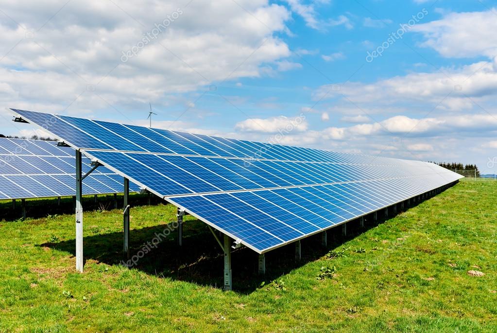 Solar panels on a green field — Stock Photo © amoklv #121537836
