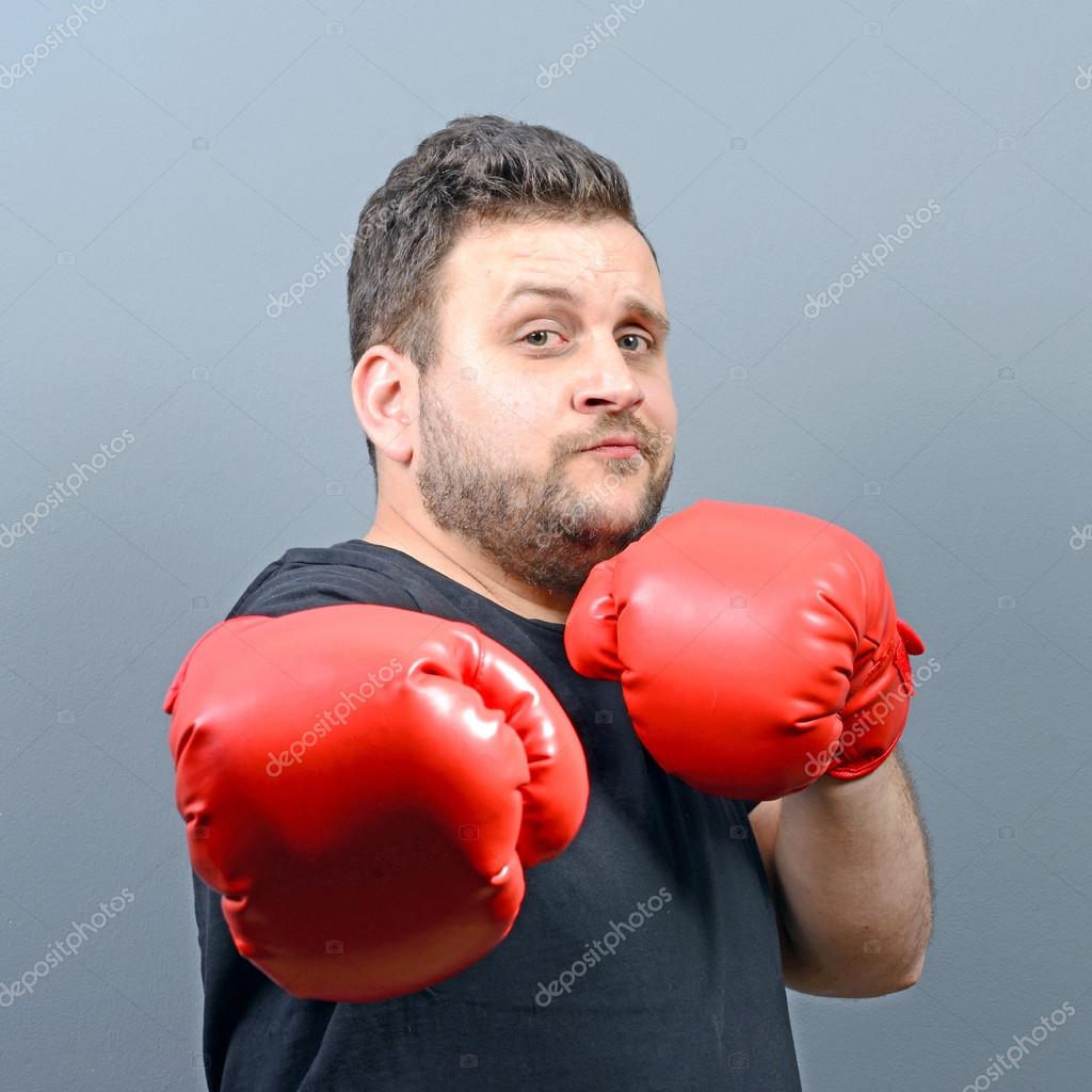 Portrait of chubby boxer posing with boxing gloves Stock Photo by ...