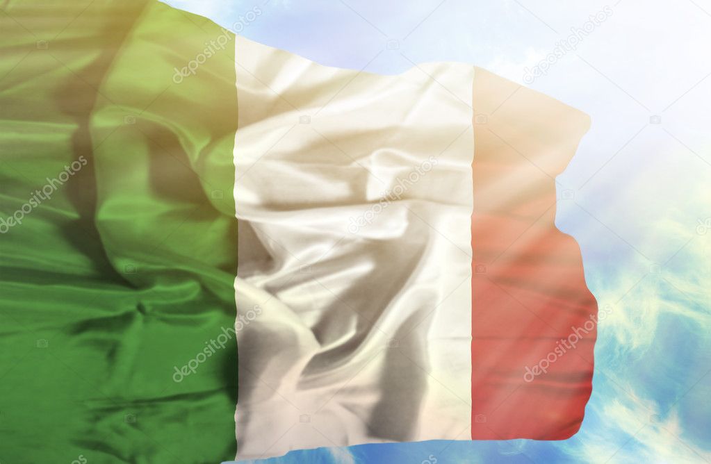 Italy waving flag against blue sky with sunrays — Stock Photo ...
