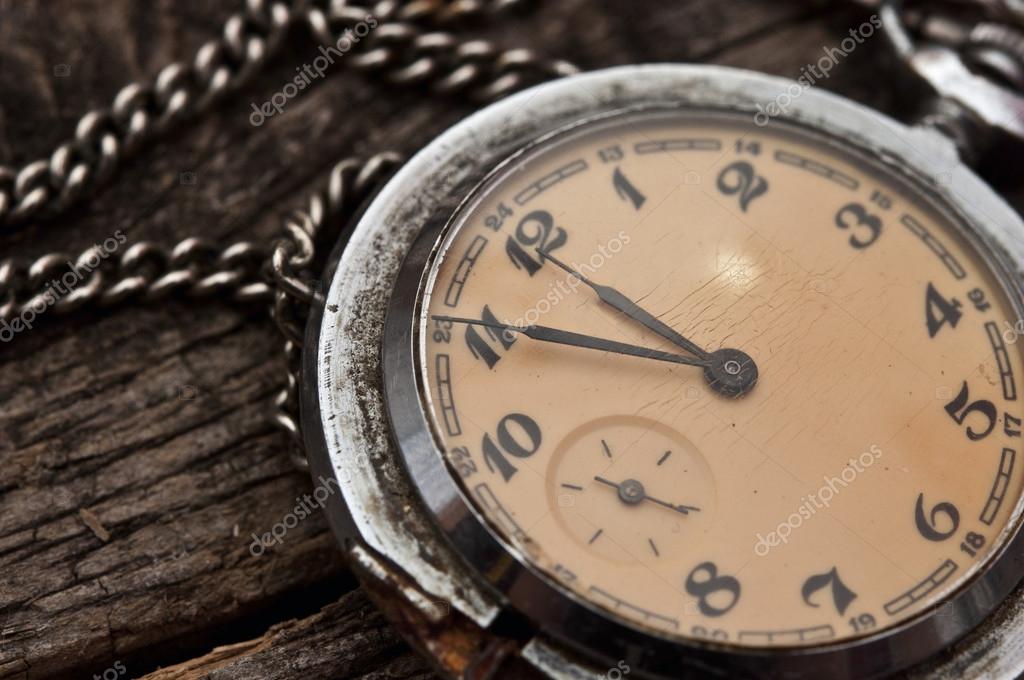 Old pocket watch on a rustic vintage wooden background Stock Photo by ...