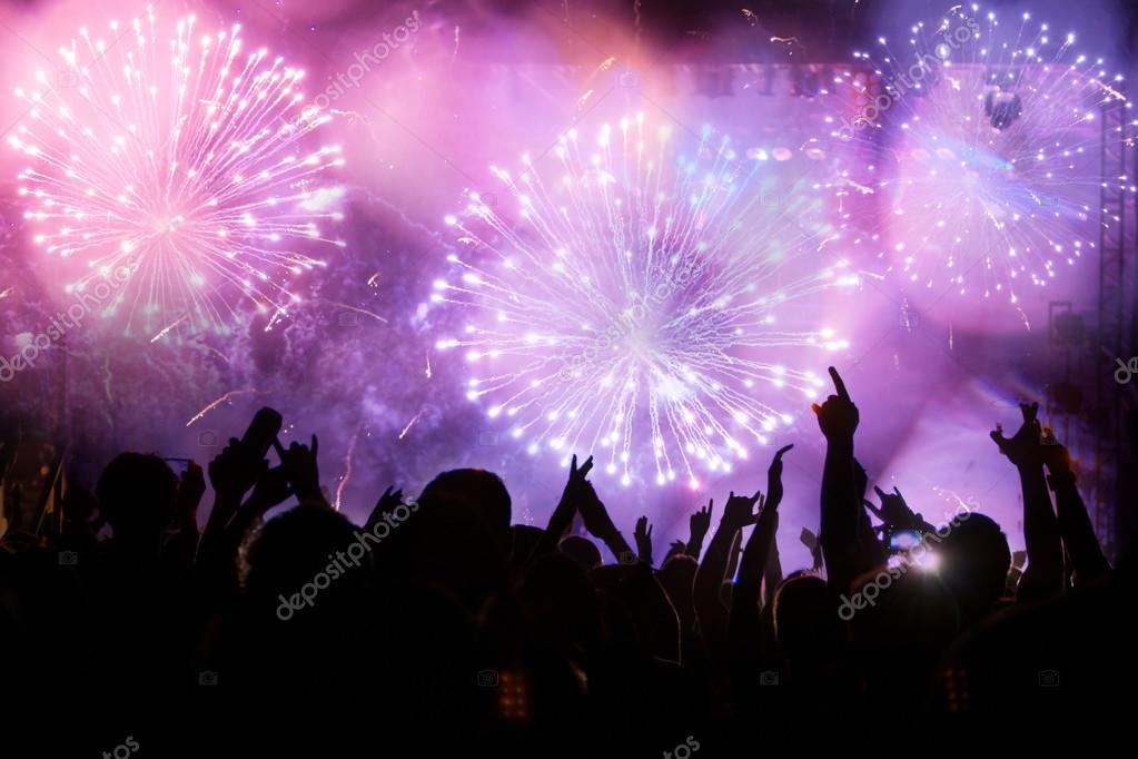 Fireworks and cheering crowd celebrating Stock Photo by ©erika8213 60774391