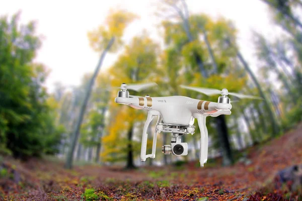 White drone quad copter with 4K digital camera flying. - Stock Image ...