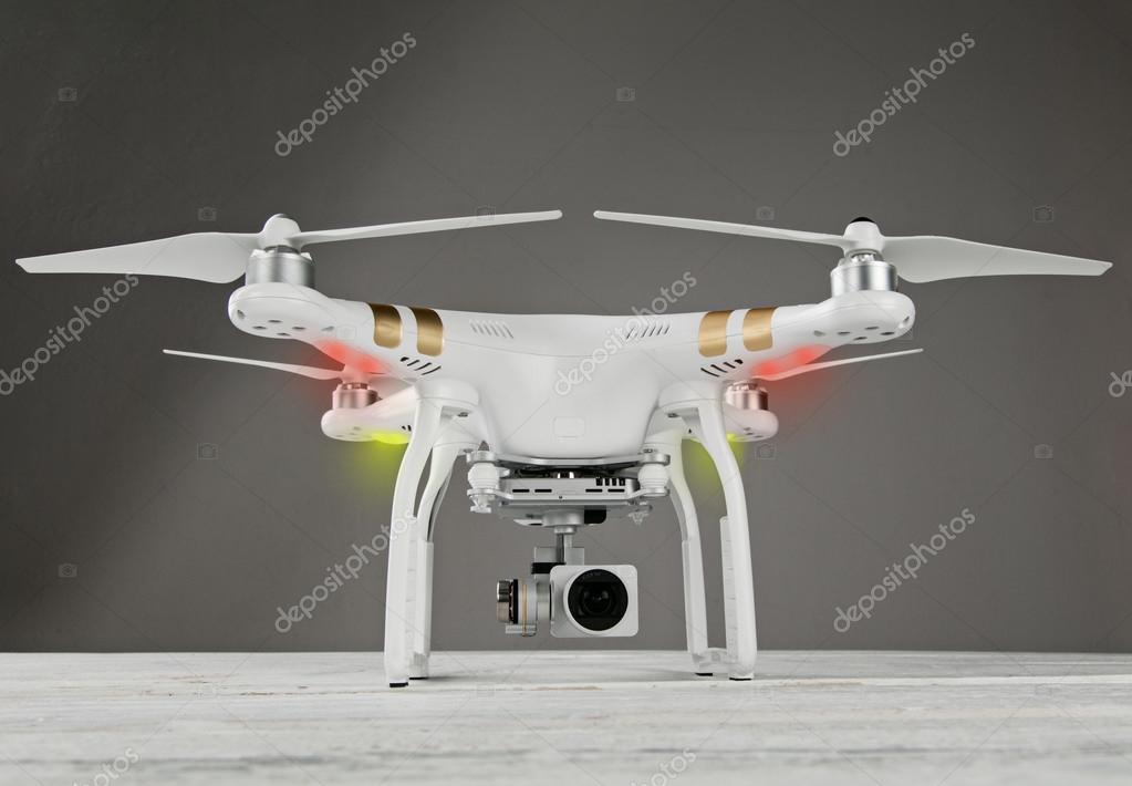 White drone quad copter with 4K digital camera. — Stock Photo © Kesu01 ...