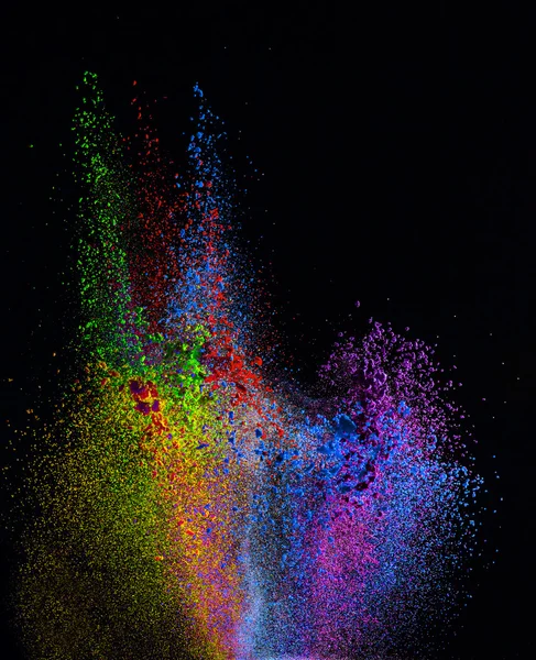 Freeze motion of colored dust explosion. - Stock Image - Everypixel